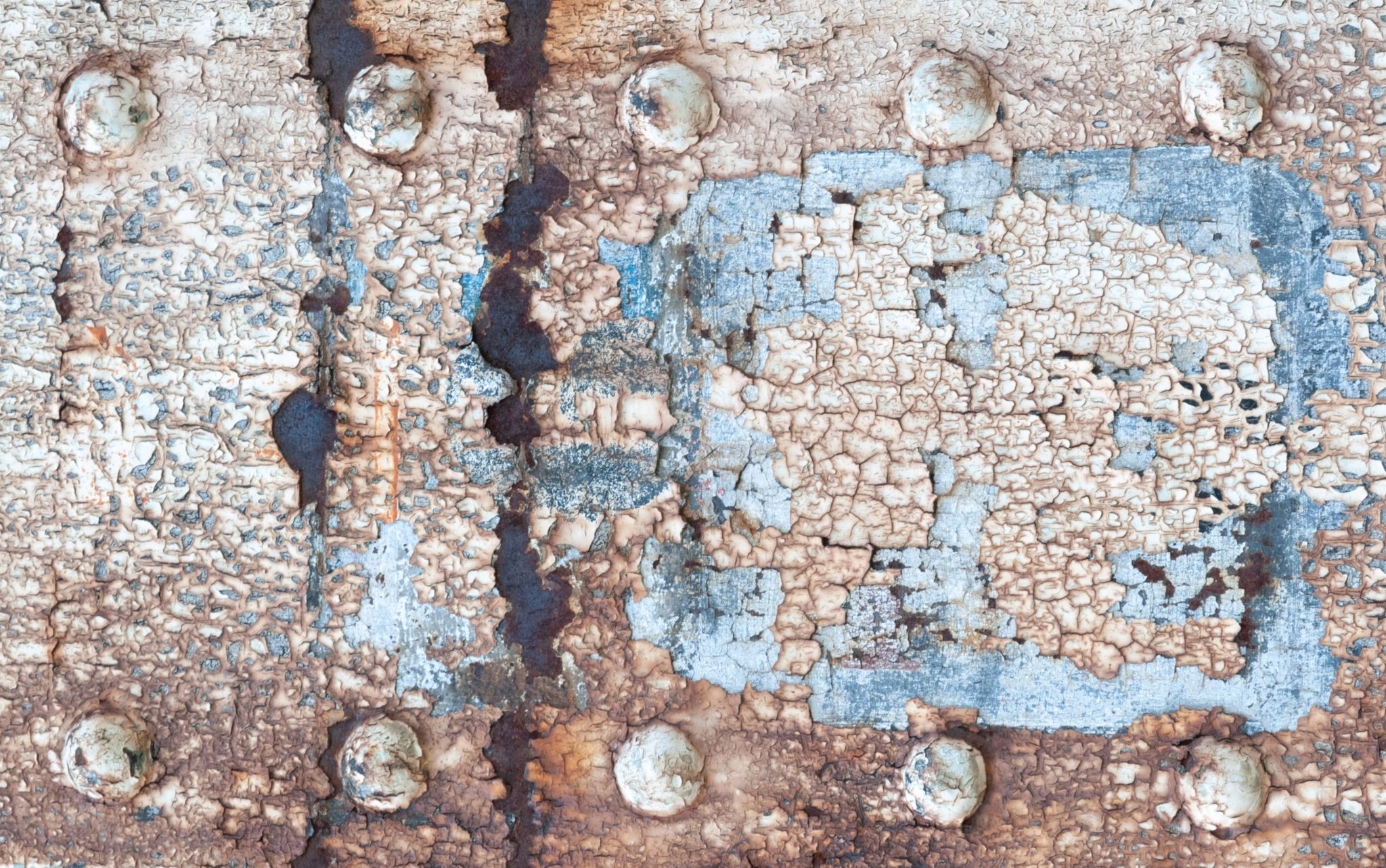 Eroded rusty metal surface with bolts - PatternPictures